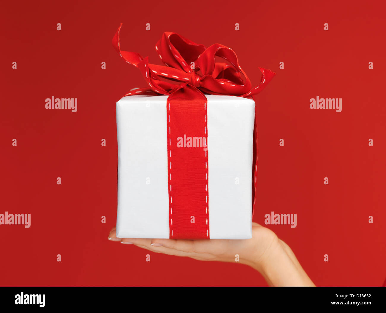 woman's hands holding a gift box Stock Photo - Alamy