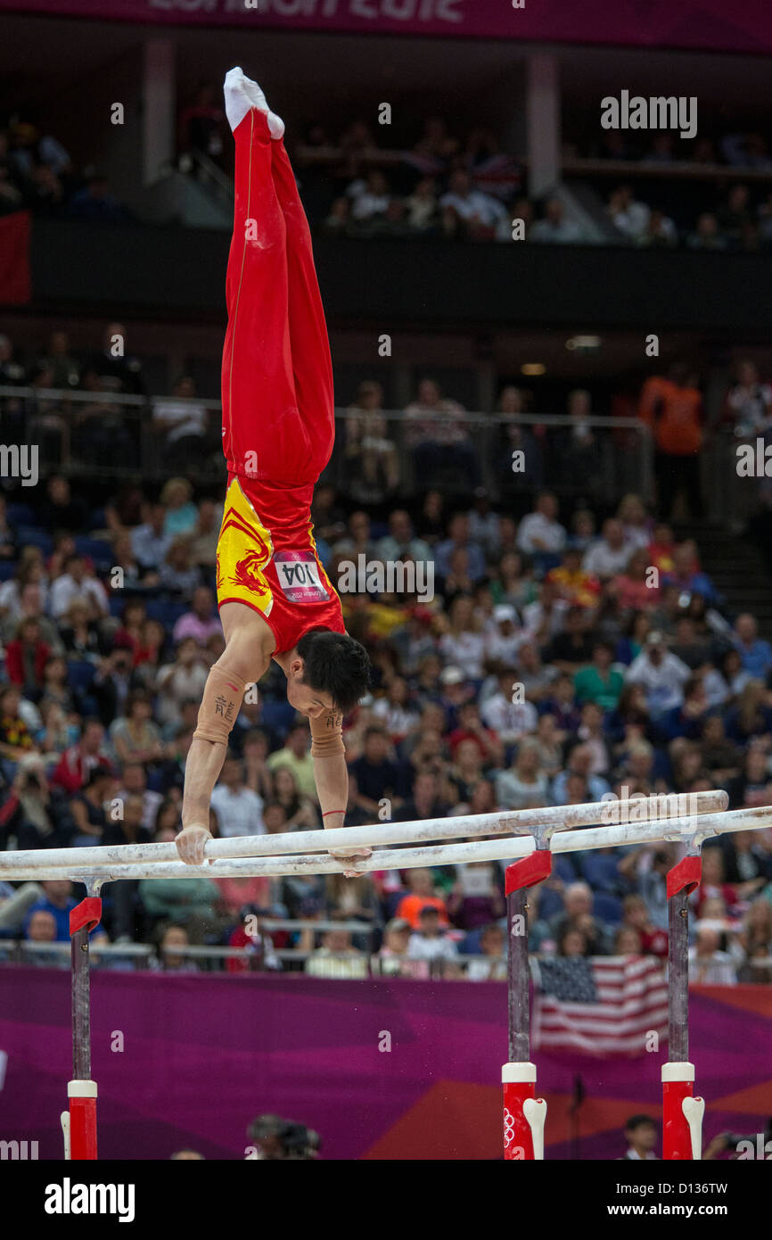 Zhang Chenglong (CHN) competing on the parallel bars during the men's ...