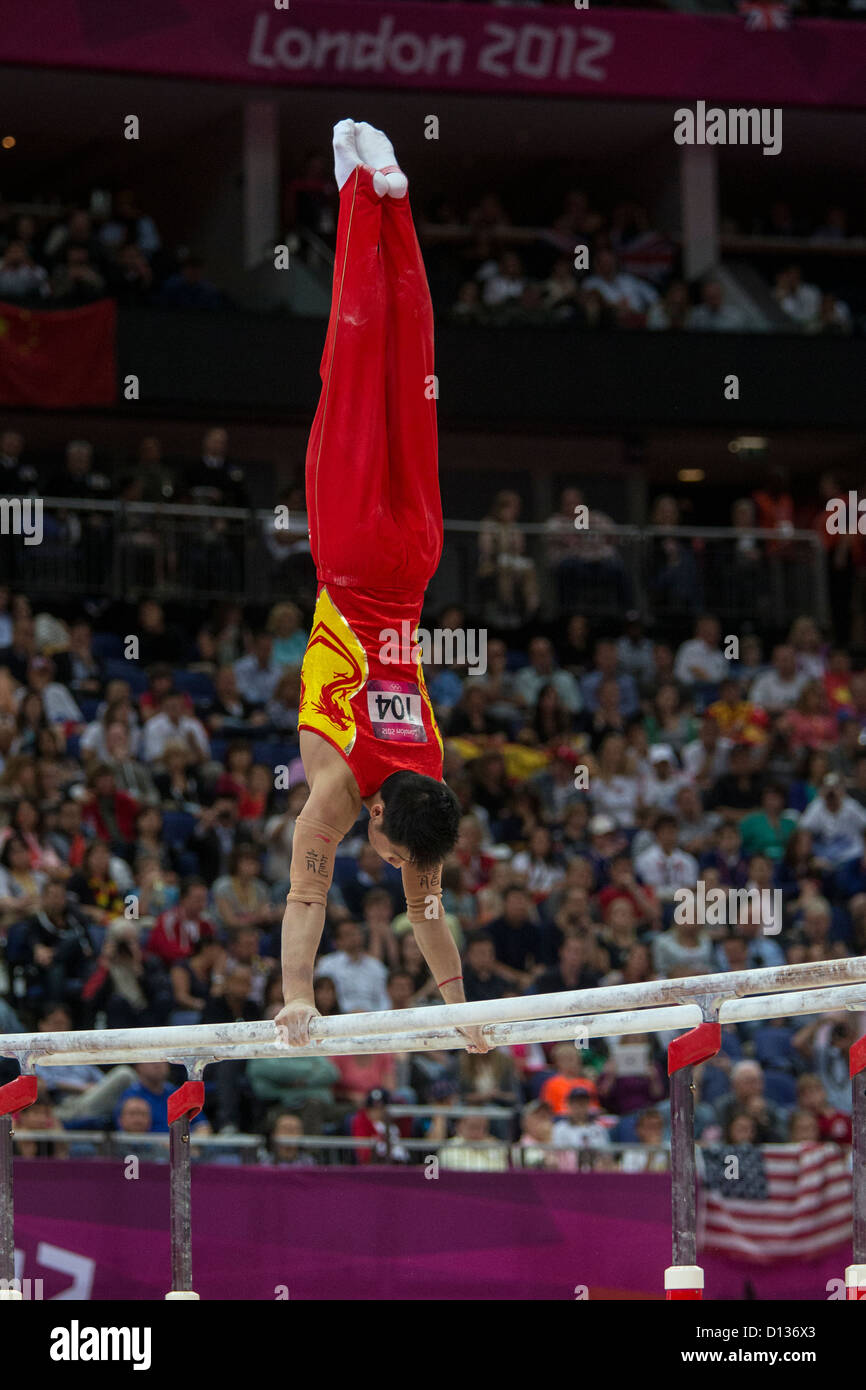 Zhang Chenglong (CHN) competing on the parallel bars during the men's ...