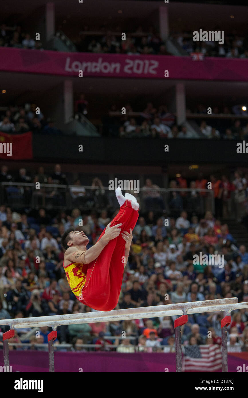 Zhang Chenglong (CHN) competing on the parallel bars during the men's ...