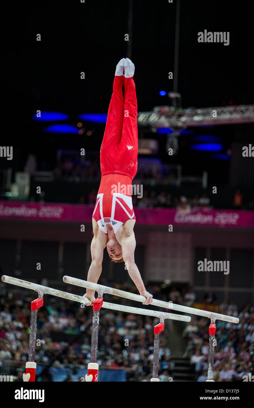 Daniel Purvis (GBR) competing on the parallel bars during the men's ...