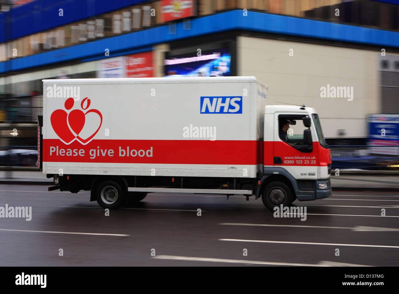 A NHS truck traveling along a road in London Stock Photo - Alamy