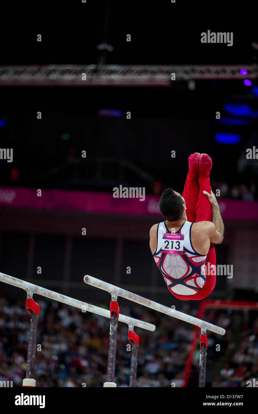 Danell Leyva (USA) competing on the parallel bars during the men's team ...