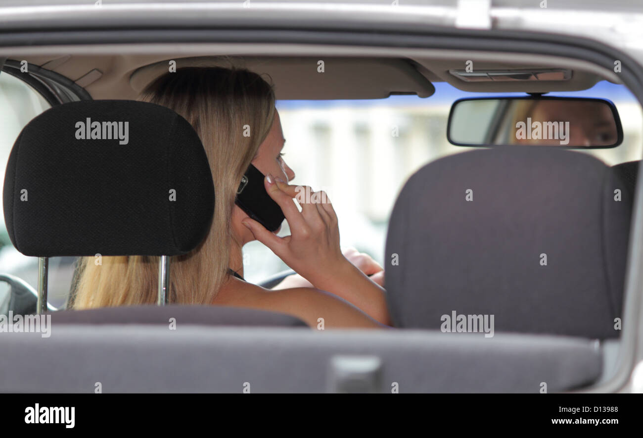 Driving a car from the back seat hi-res stock photography and images ...