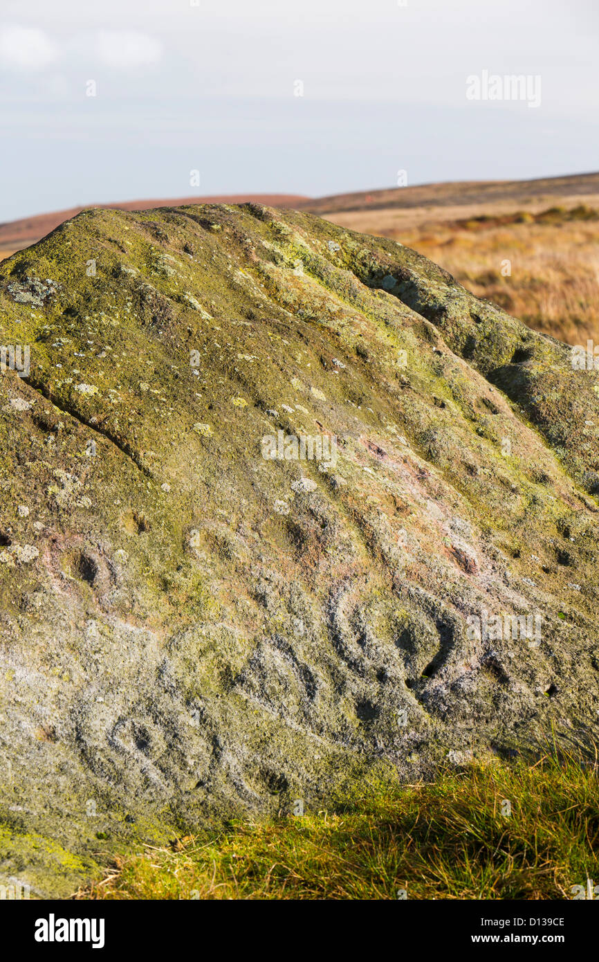 Cup and ring marks on the ancient Badger Stone on Ilkley Moor ...