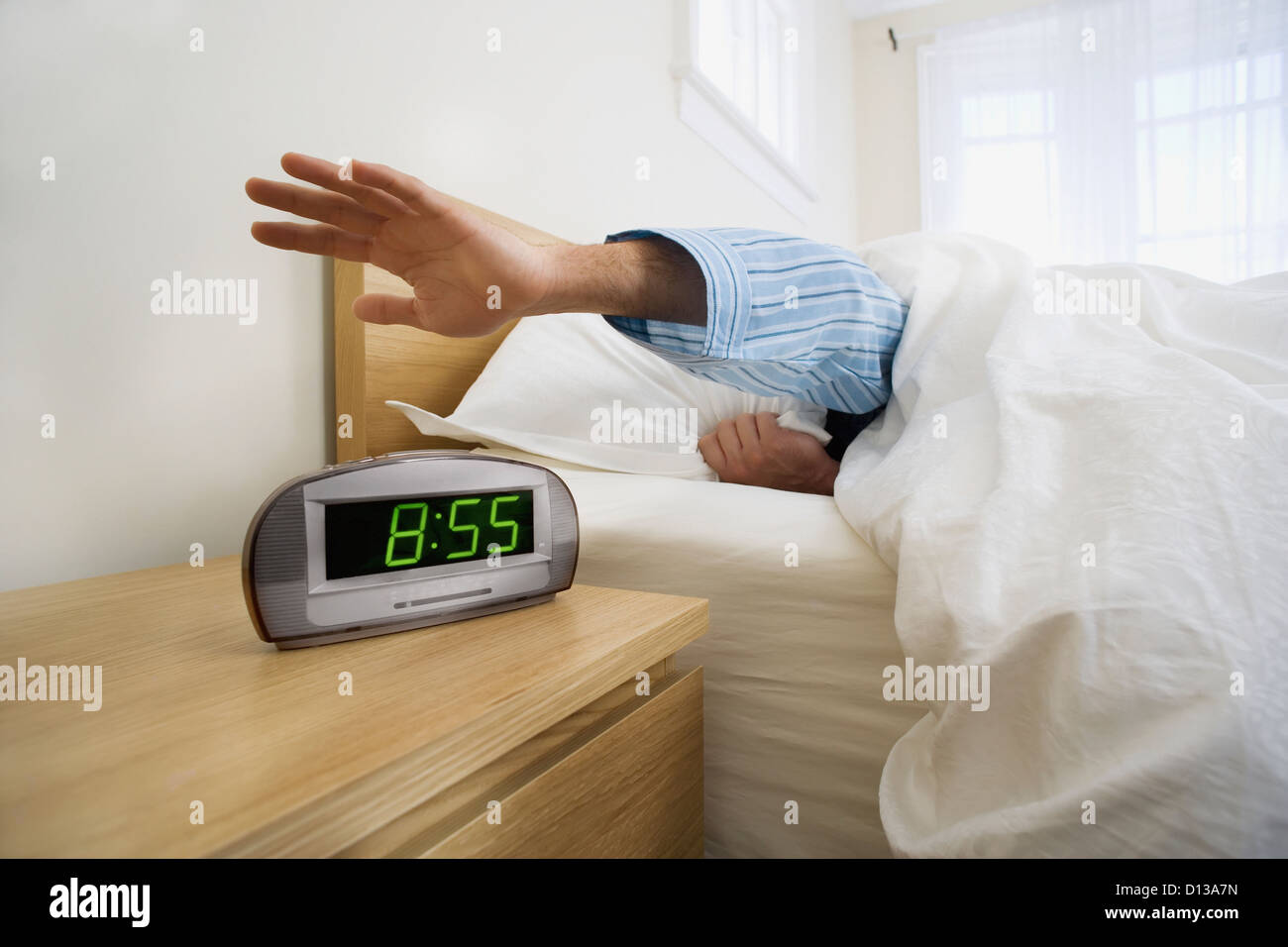 Man Shutting Off Alarm Clock; Toronto Ontario Canada Stock Photo - Alamy