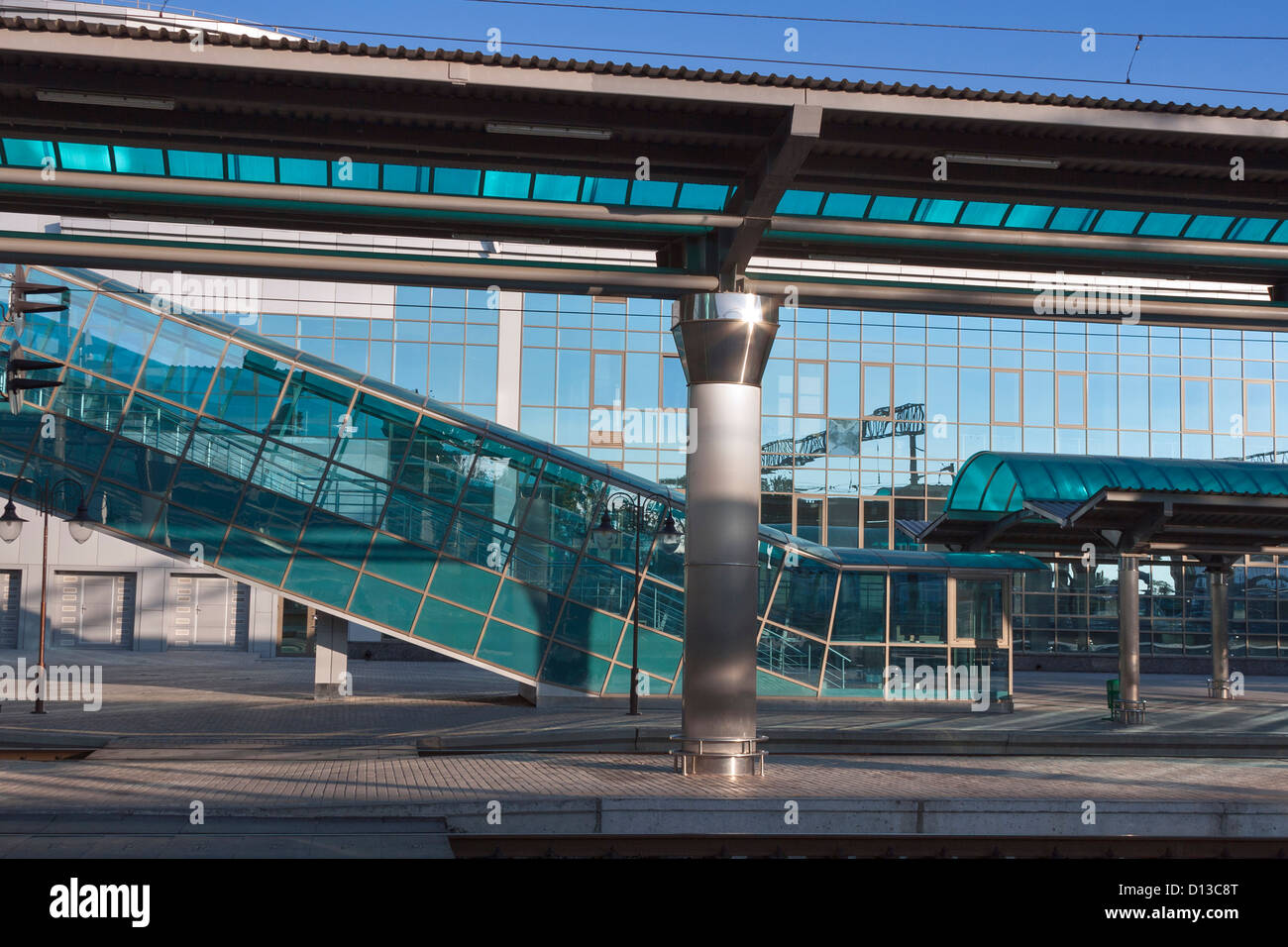 Pedestrian crossing at modern railroad station Stock Photo - Alamy