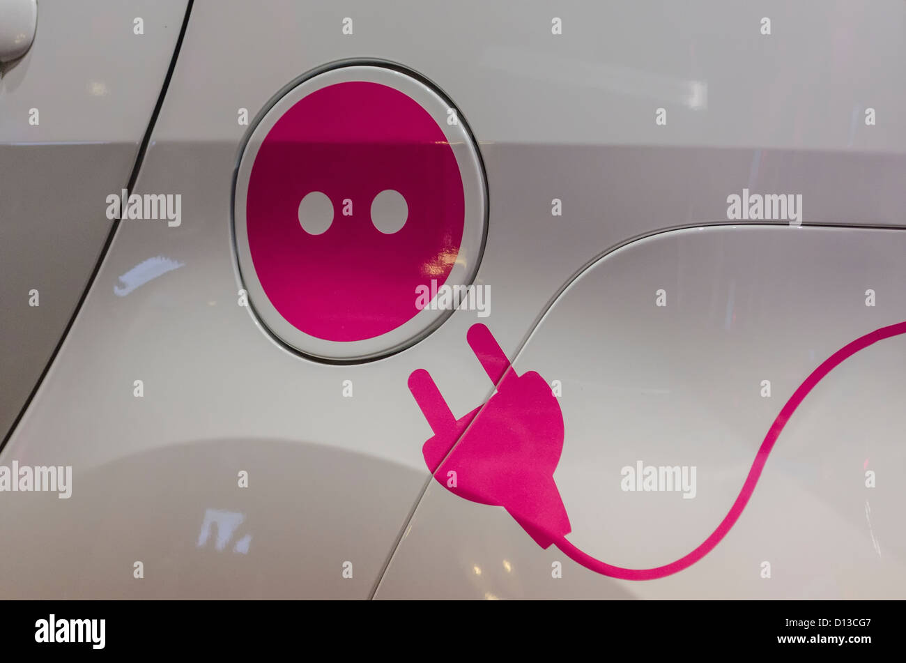 Power point and plug symbols on electric car Stock Photo - Alamy
