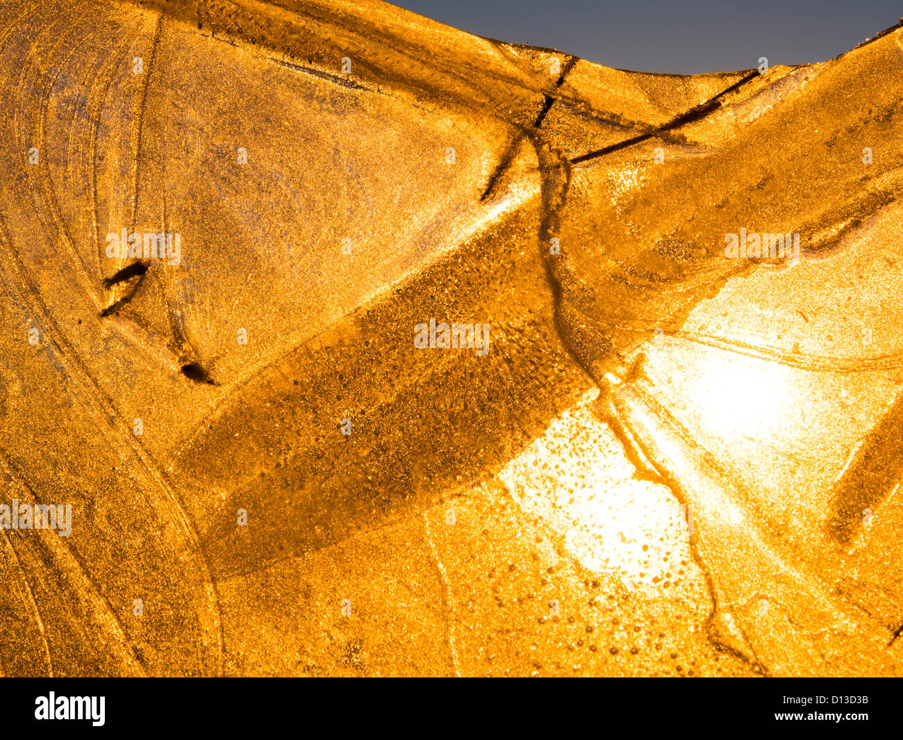 Sunset light seen through a sheet of ice Stock Photo - Alamy
