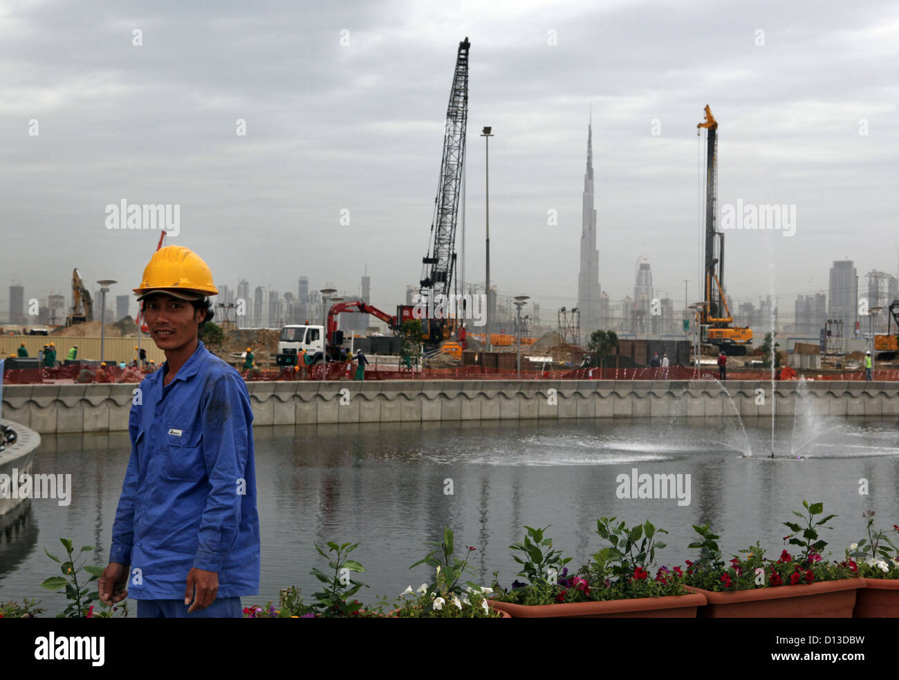Dubai, United Arab Emirates, construction workers against the skyline ...