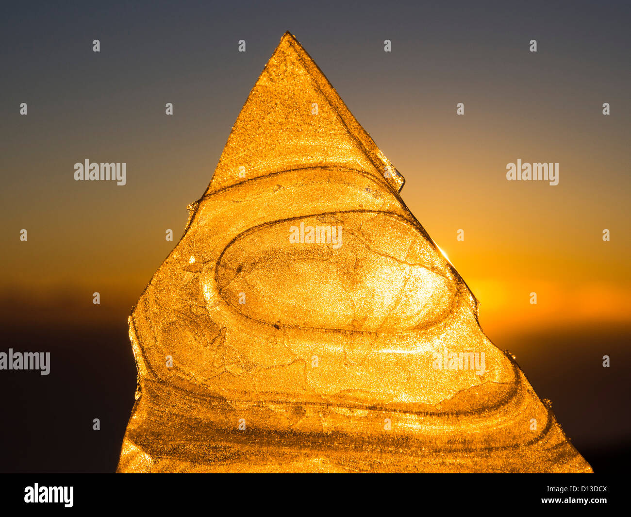 Sunset light seen through a sheet of ice Stock Photo - Alamy