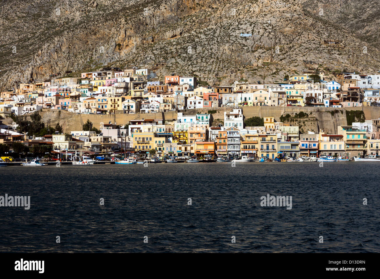 Pothia, Kalymnos, Greece, town with Greek flag Stock Photo - Alamy