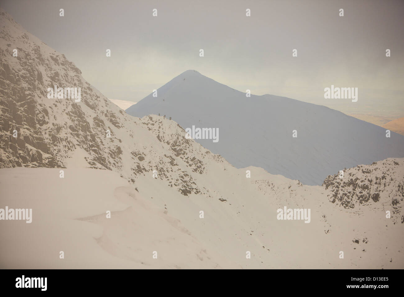 Striding edge winter walker snow hi-res stock photography and images ...