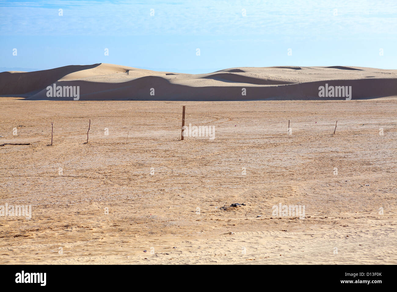Deserted area in Sahara desert with dunes on background Stock Photo - Alamy
