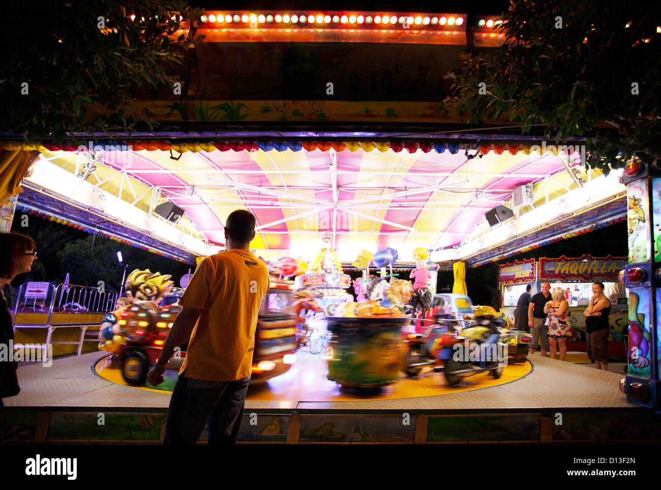 Port d'Alcudia, Mallorca, Spain, on a carousel at night the harbor ...
