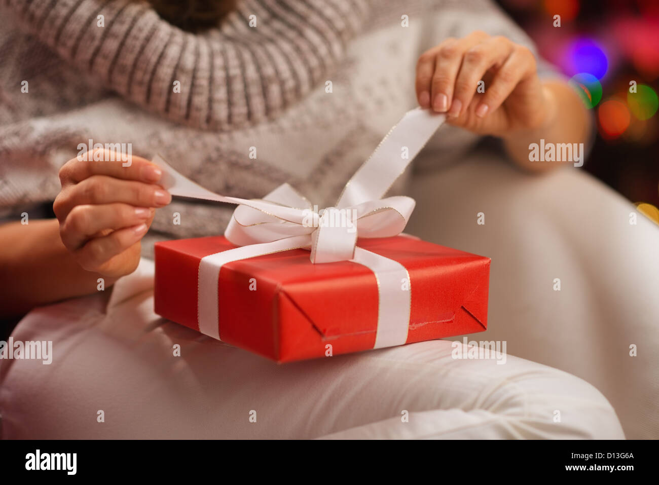 Closeup on woman opening Christmas present box Stock Photo - Alamy