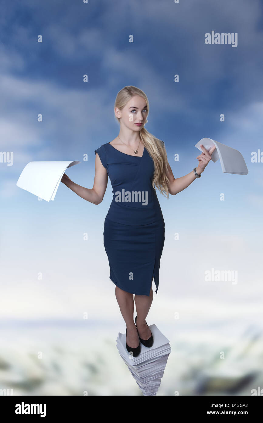 woman standing on a large pile of paper Stock Photo - Alamy
