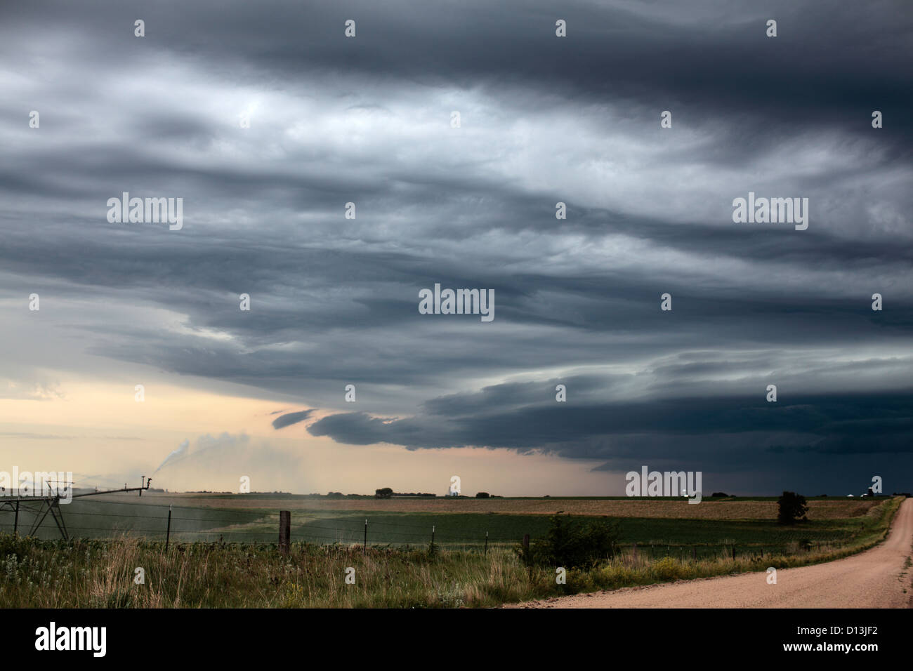 Large wall cloud and irrigation Stock Photo - Alamy