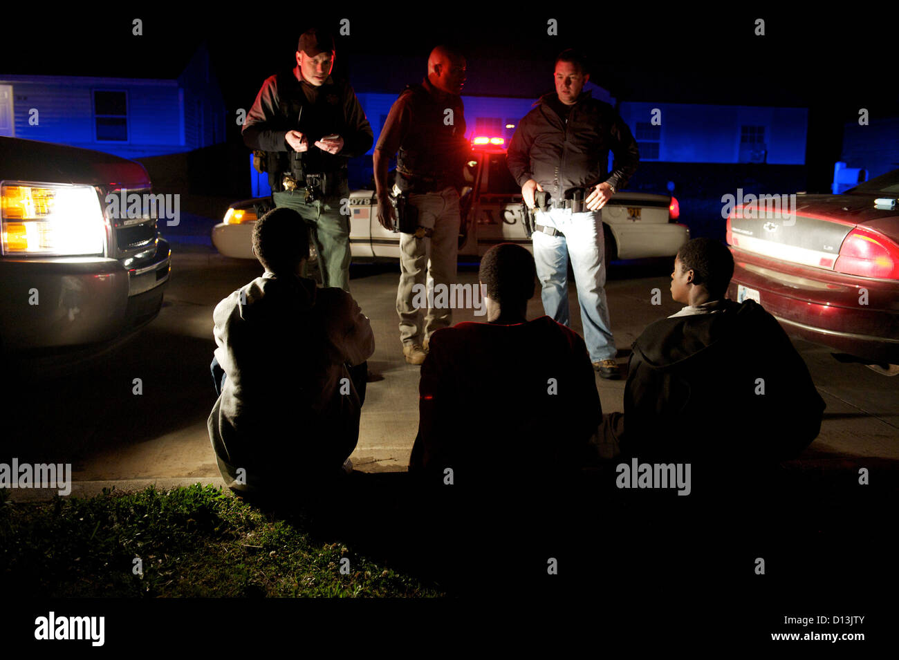 Suspected gang members are questioned following raids by the US ...