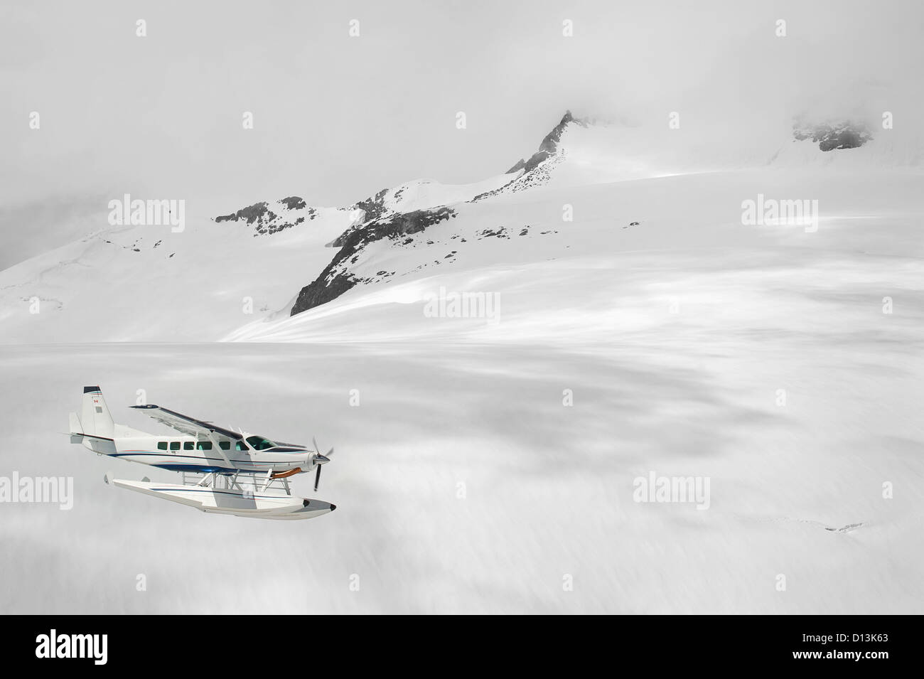 Cessna Caravan Amphibian Seaplane Flying Through The Coast Mountains ...