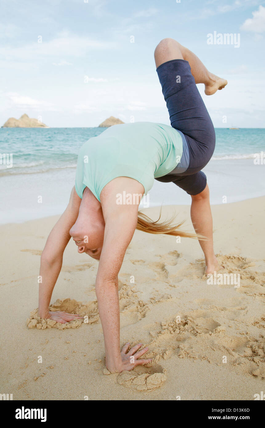 Hawaii, Oahu, Lanikai, Young Woman Does Yoga On The Beach Stock Photo ...