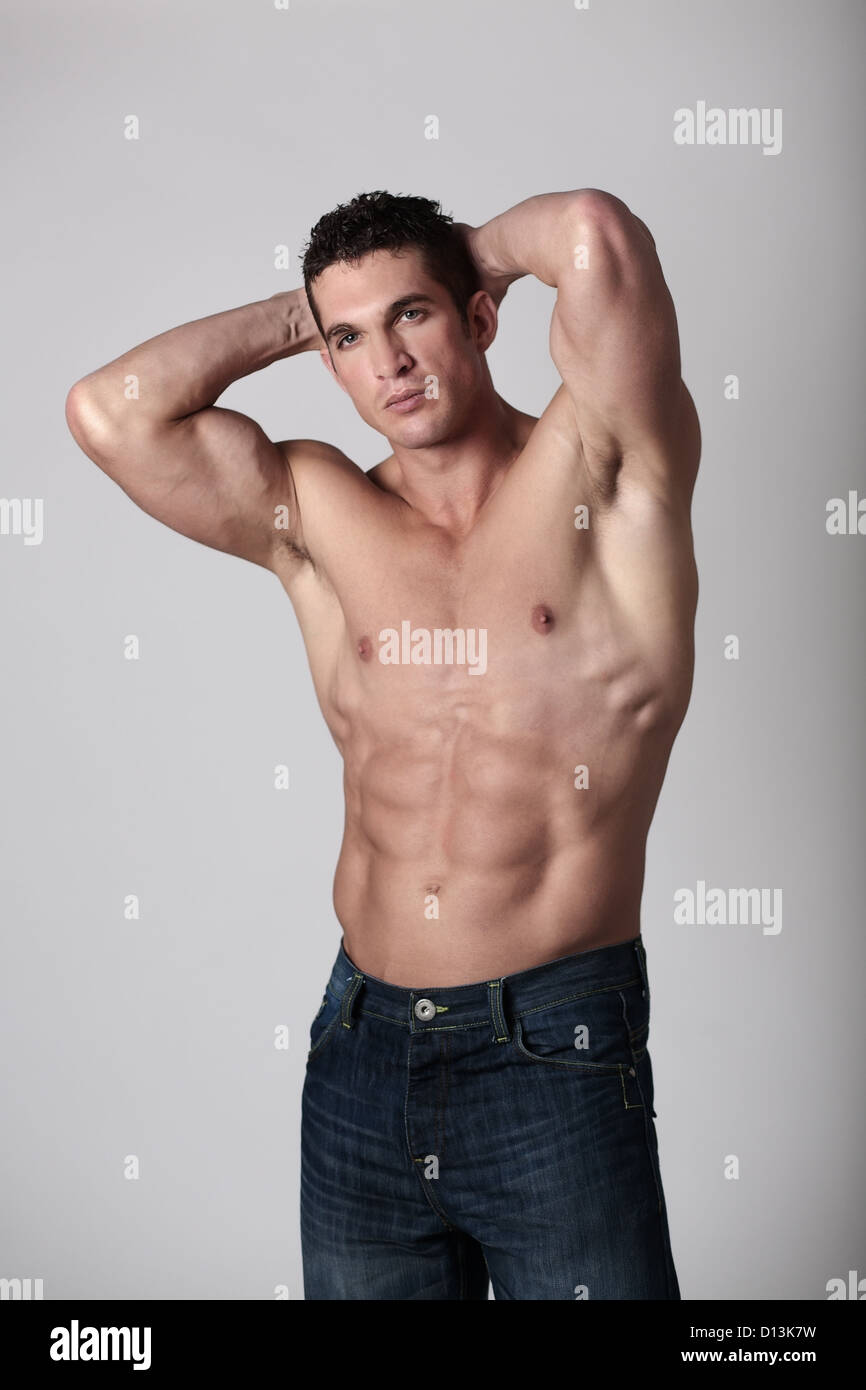 good looking man with his top of showing off his great body Stock Photo ...