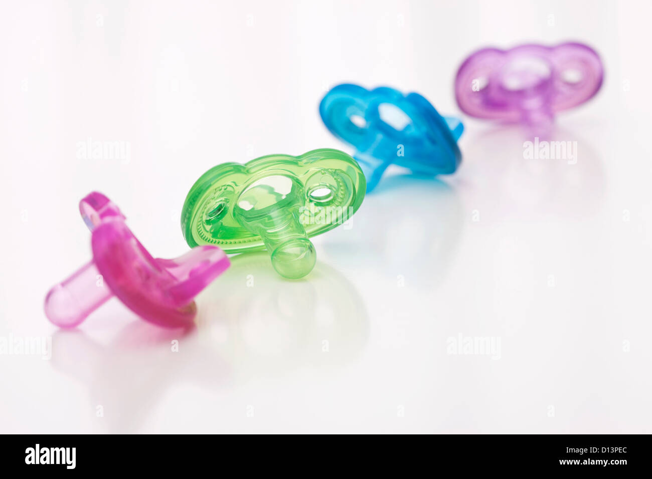 Studio shot of colorful pacifiers Stock Photo - Alamy