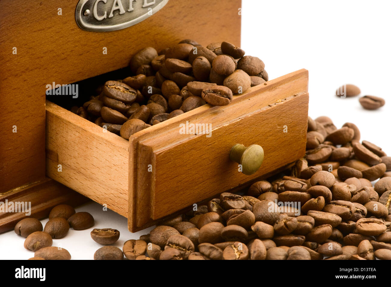 wooden coffee grinder drawer with beans on white Stock Photo - Alamy
