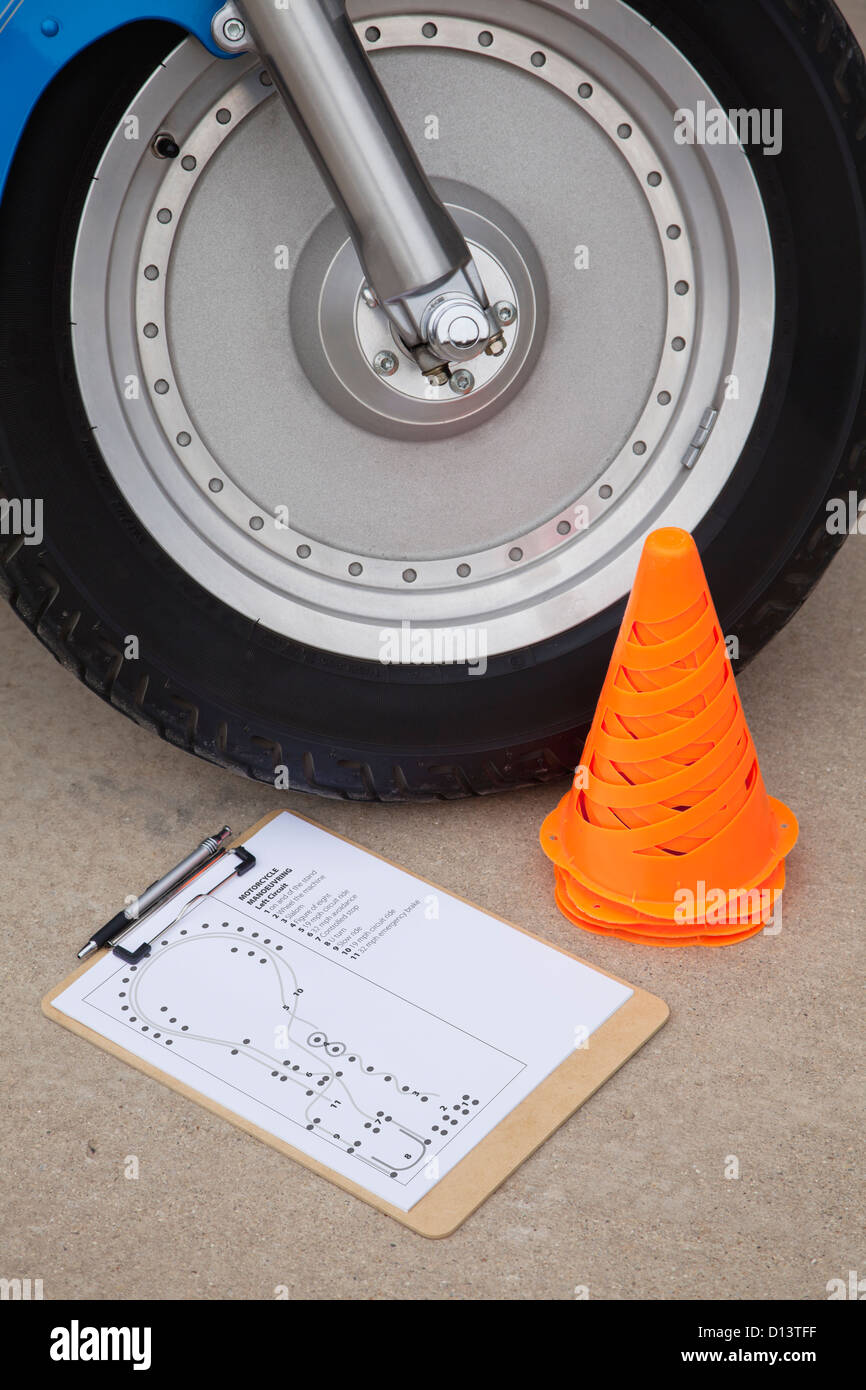 USA, Illinois, Metamora, Close up of motorcycle wheel, traffic cone and ...
