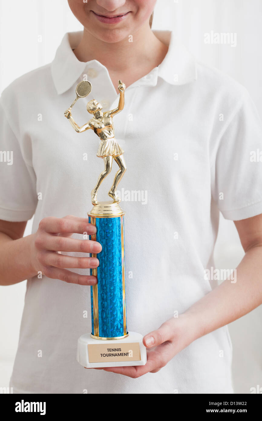 Hand holding up trophy hi-res stock photography and images - Alamy