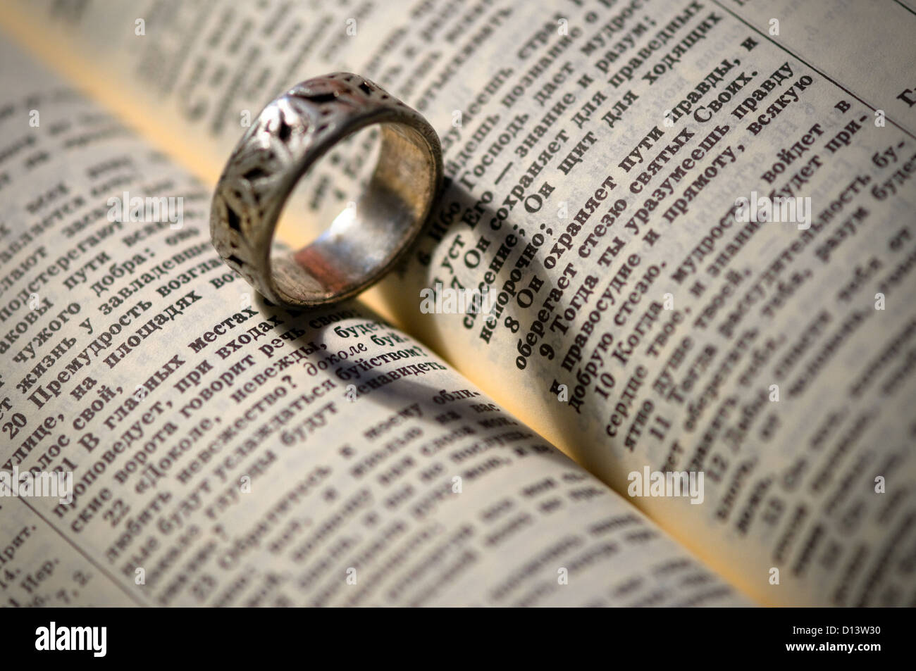 holy bible with silver ring and heart shape shadow Stock Photo - Alamy
