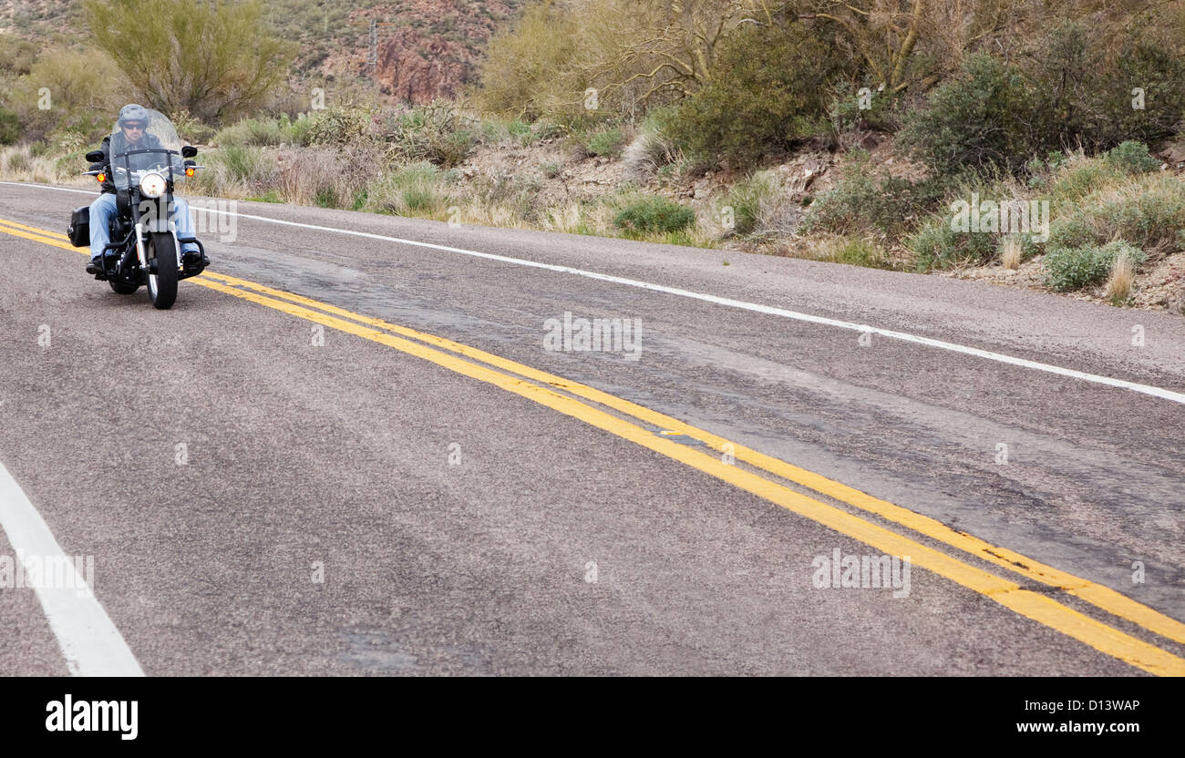 USA, Arizona, Phoenix, Biker on motorcycle in desert area Stock Photo ...