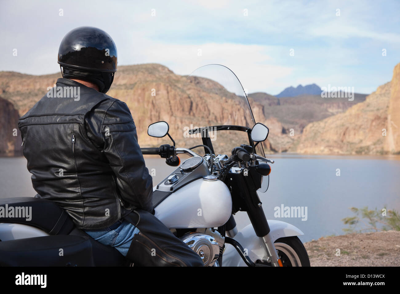 USA, Arizona, Phoenix, Biker on motorcycle in mountain area Stock Photo ...