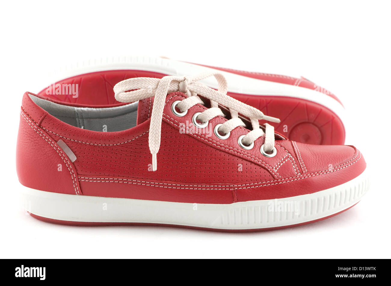 red leather sneakers on white Stock Photo - Alamy