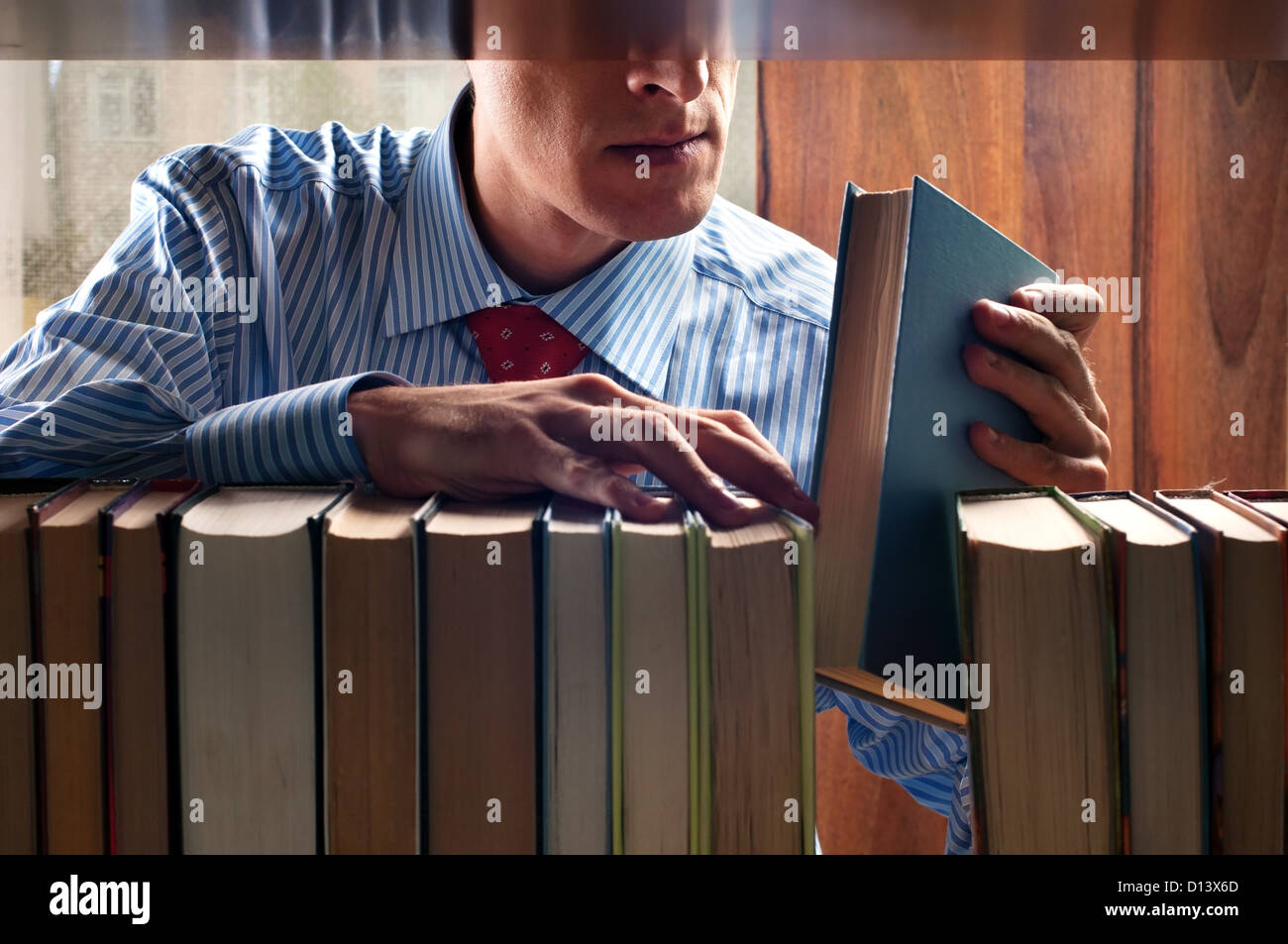 Standing next to bookshelf hi-res stock photography and images - Alamy