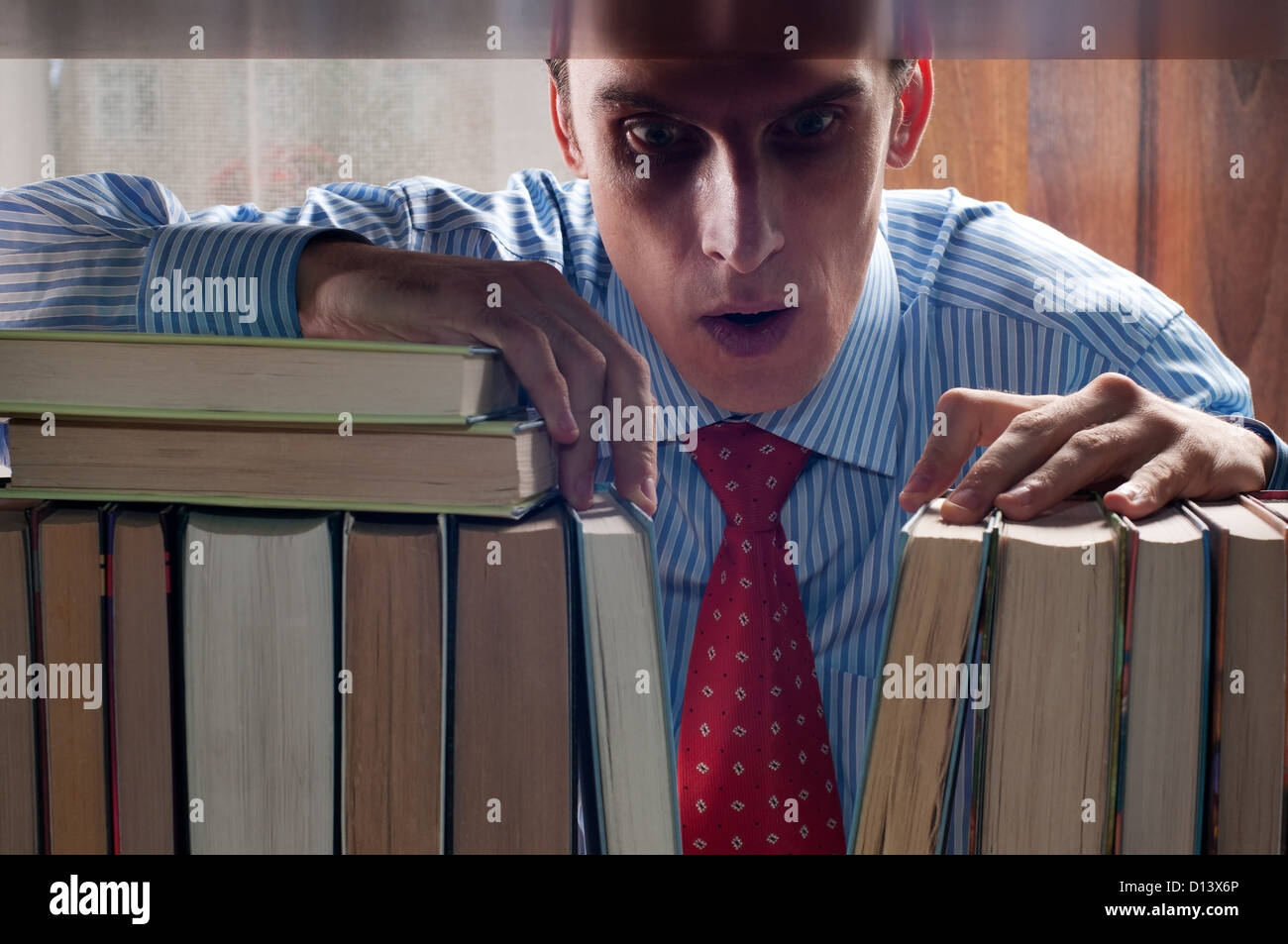 Standing next to bookshelf hi-res stock photography and images - Alamy