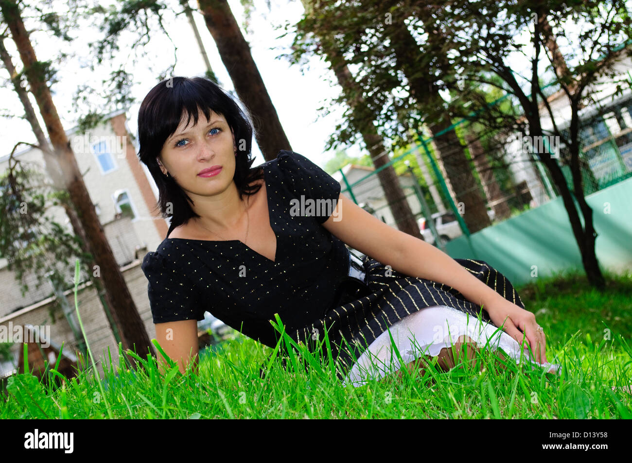girl sitting on green grass Stock Photo - Alamy