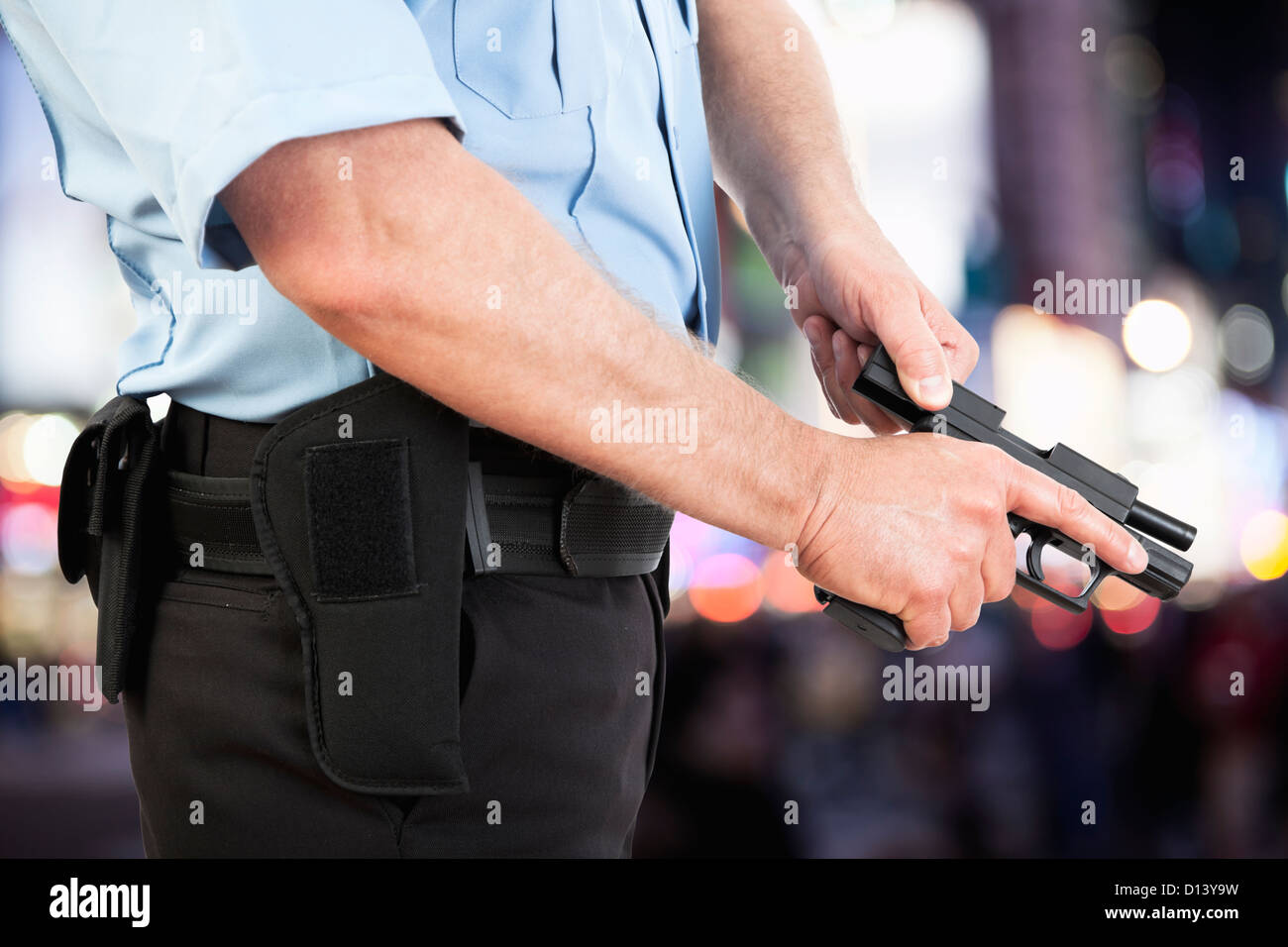 USA, Illinois, Metamora, Police officer reloading gun Stock Photo - Alamy
