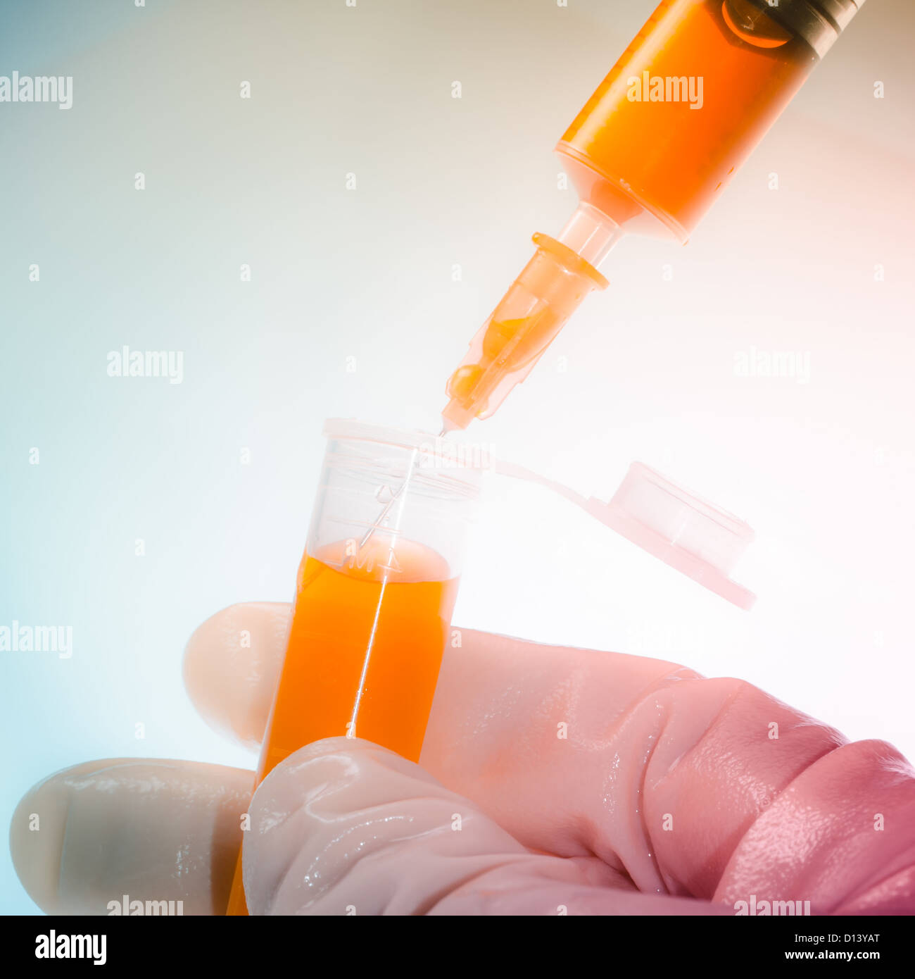 medical background syringe in hand Stock Photo - Alamy