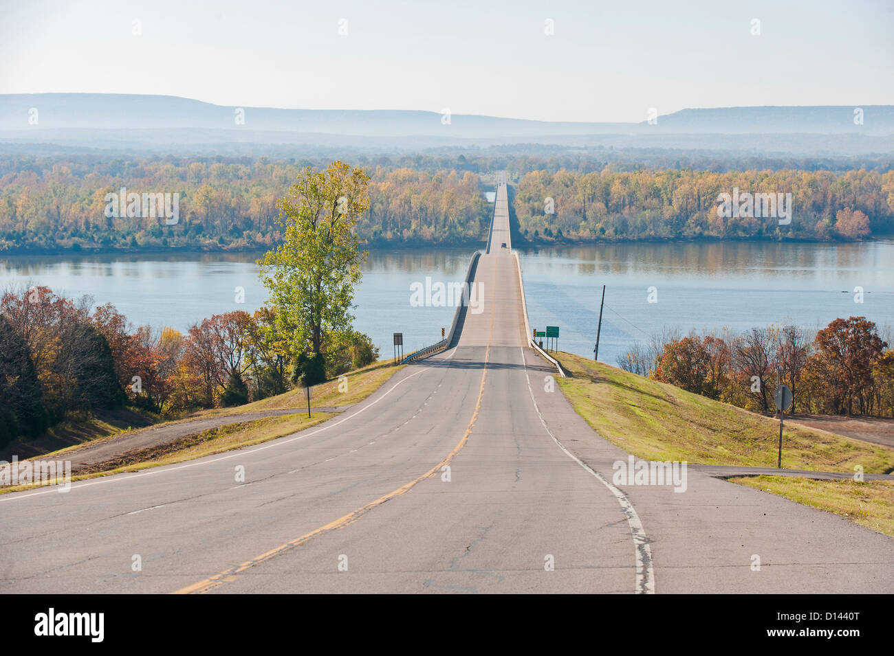 An empty bridge across a river with fall colors Stock Photo - Alamy