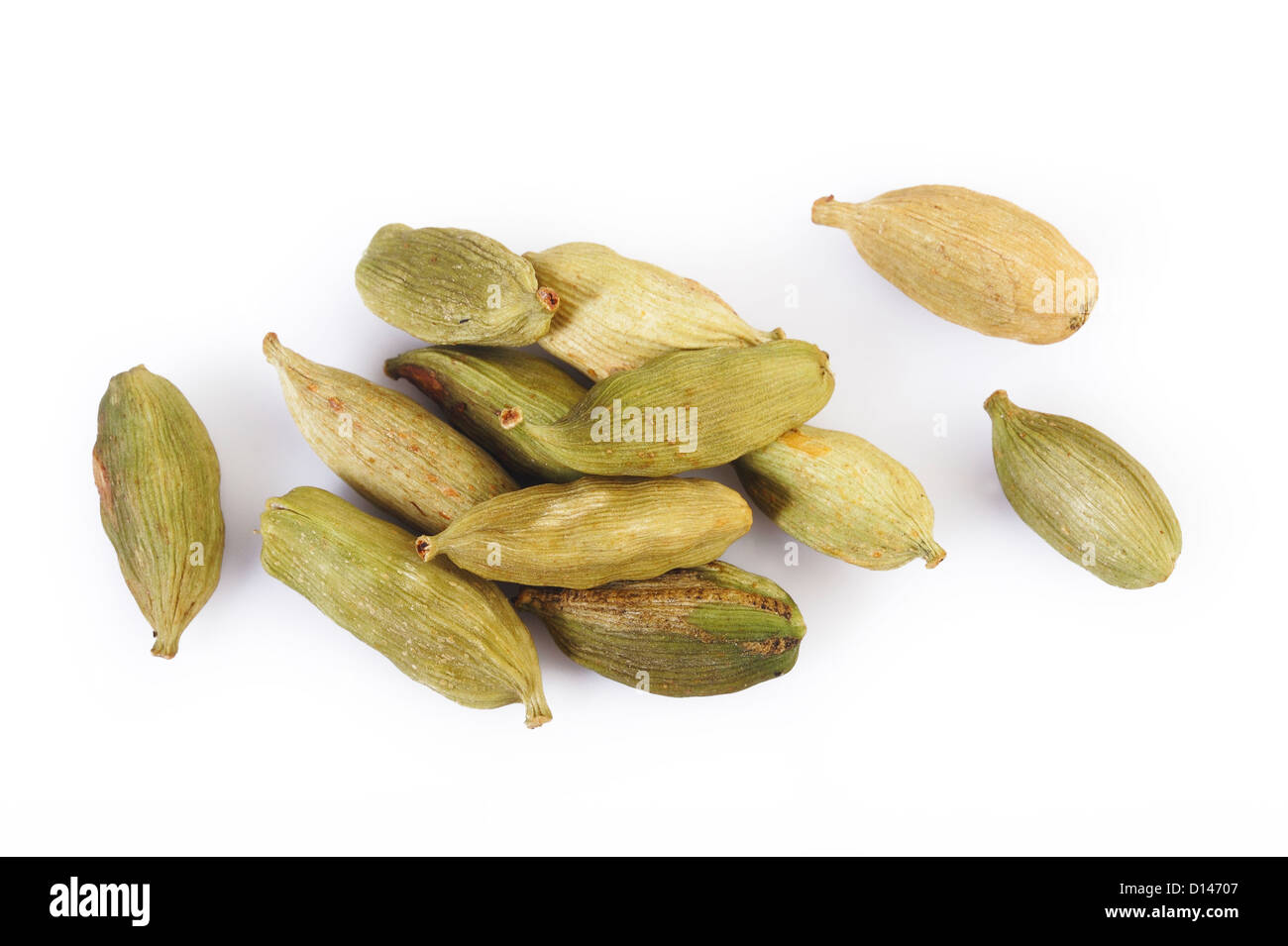 Cardamon pods on white background Stock Photo - Alamy
