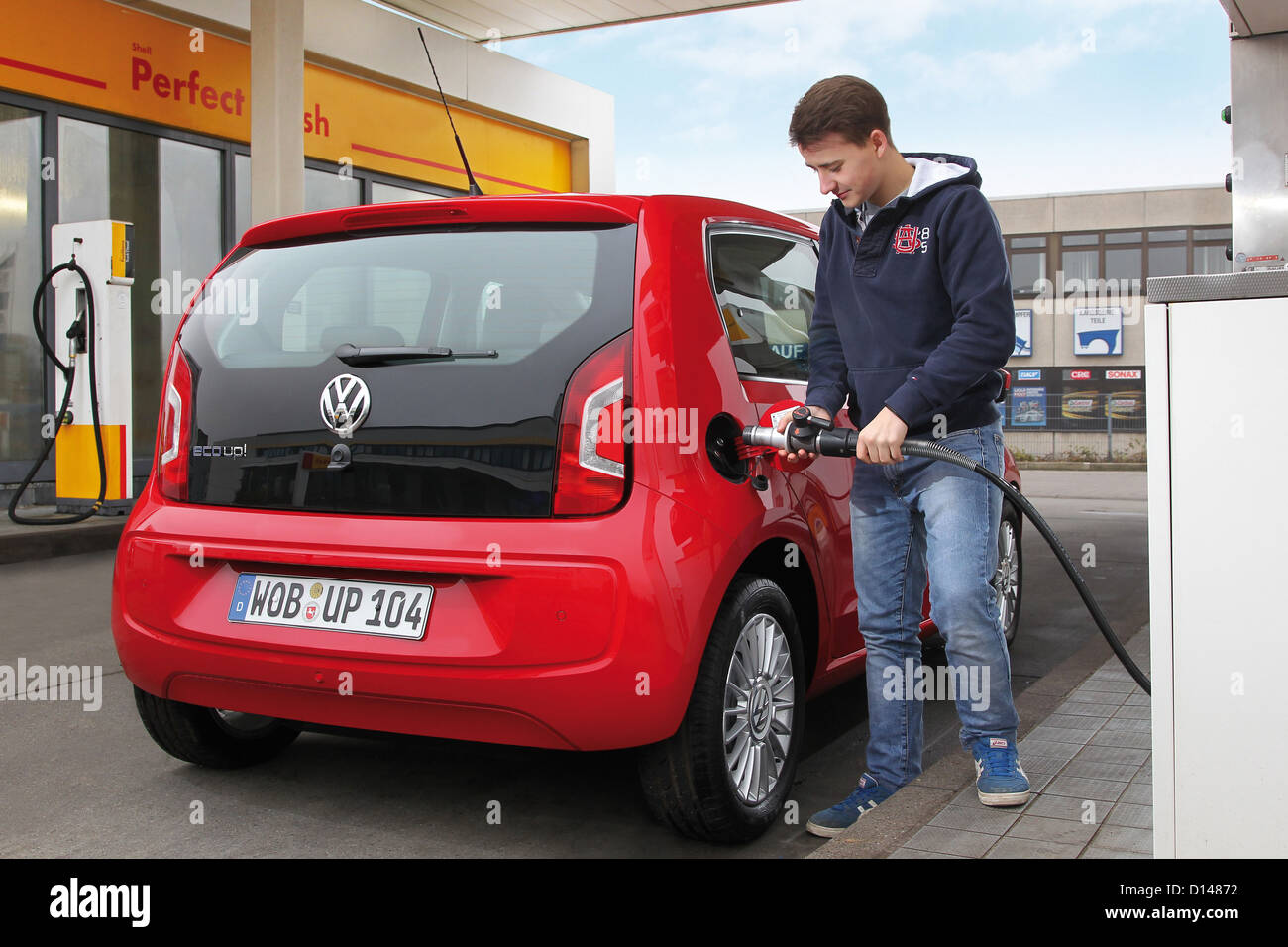 A handout picture shows a man refueling his Volkswagen (VW) car model ...