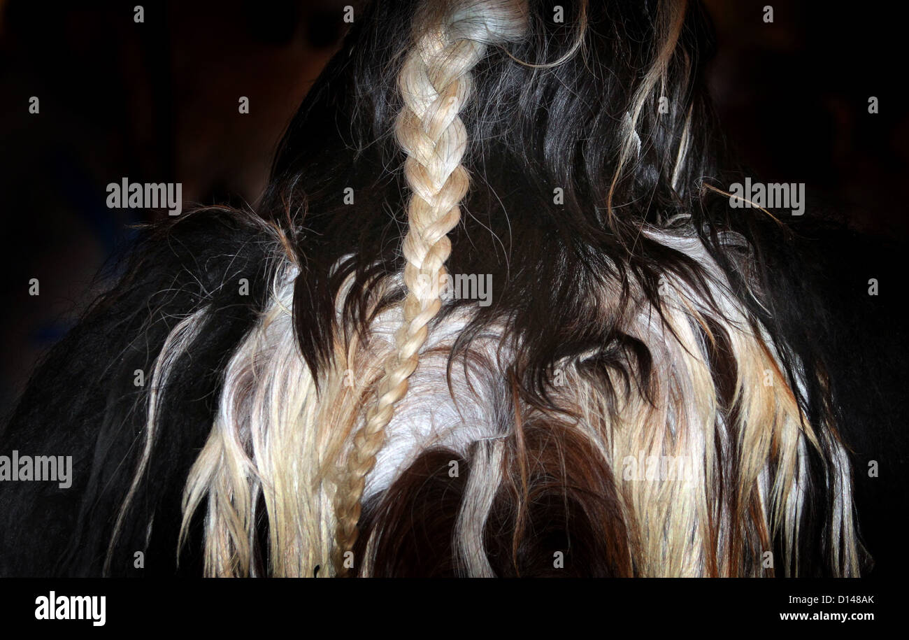 Winter fools, also known as 'Klausen', roam during a traditional parade ...
