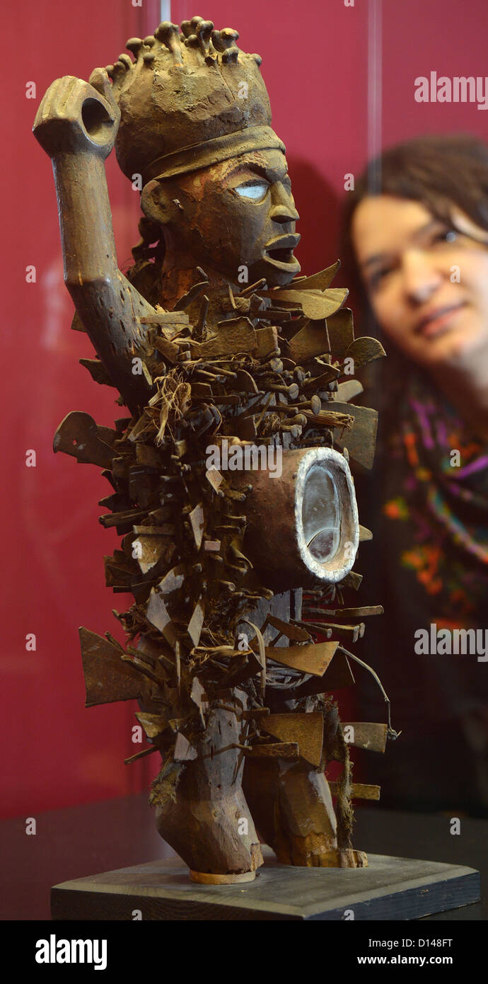 A woman views so-called Minkisi sculptures at the Grassi Museum of ...