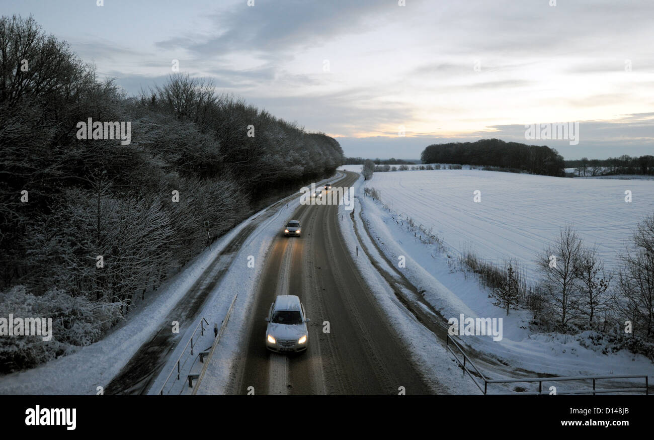 Car drive over a snow-covered highway near Aukrug, Germany, 06 December ...