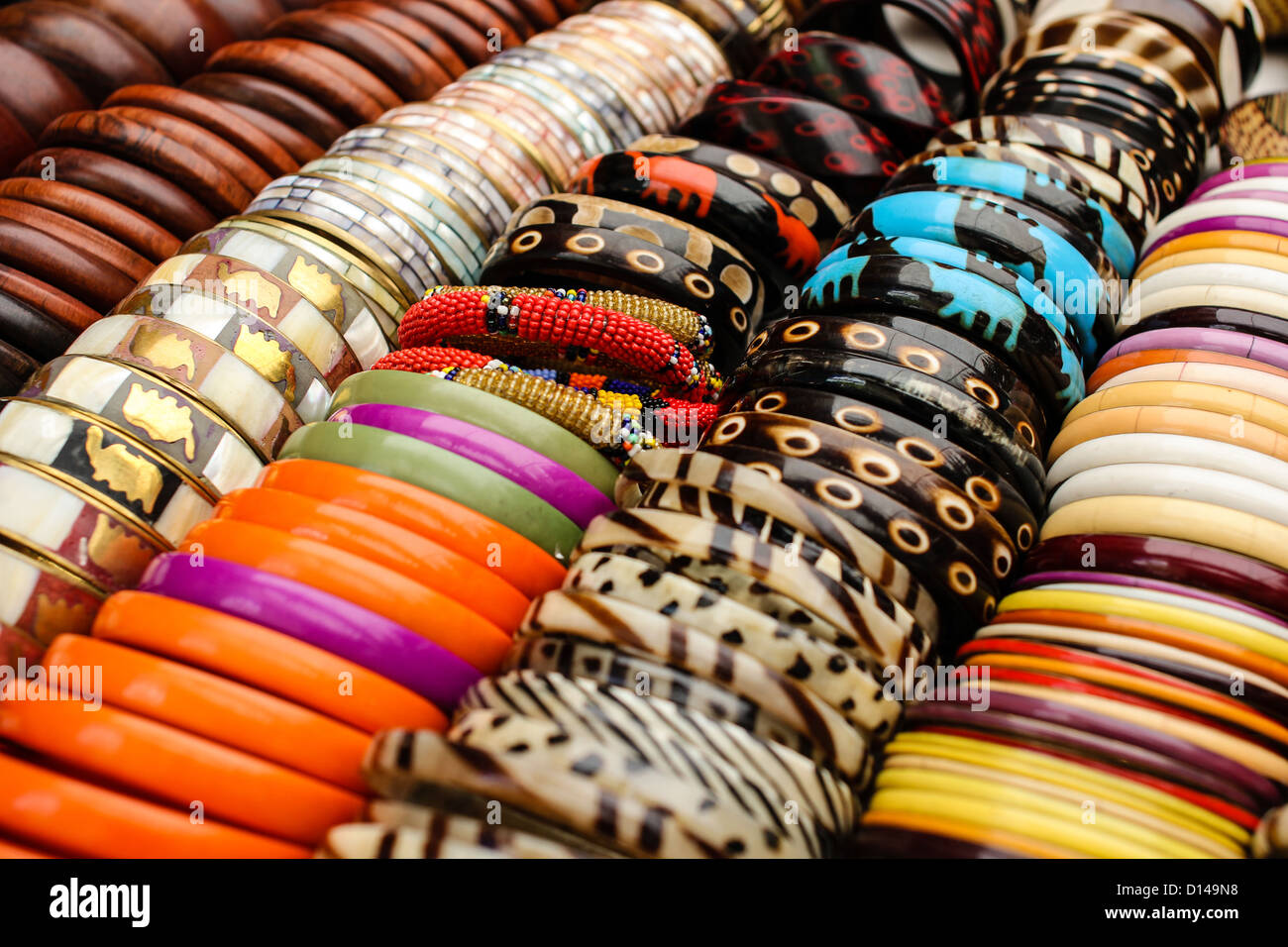 Many colorful braclets at african market Stock Photo - Alamy