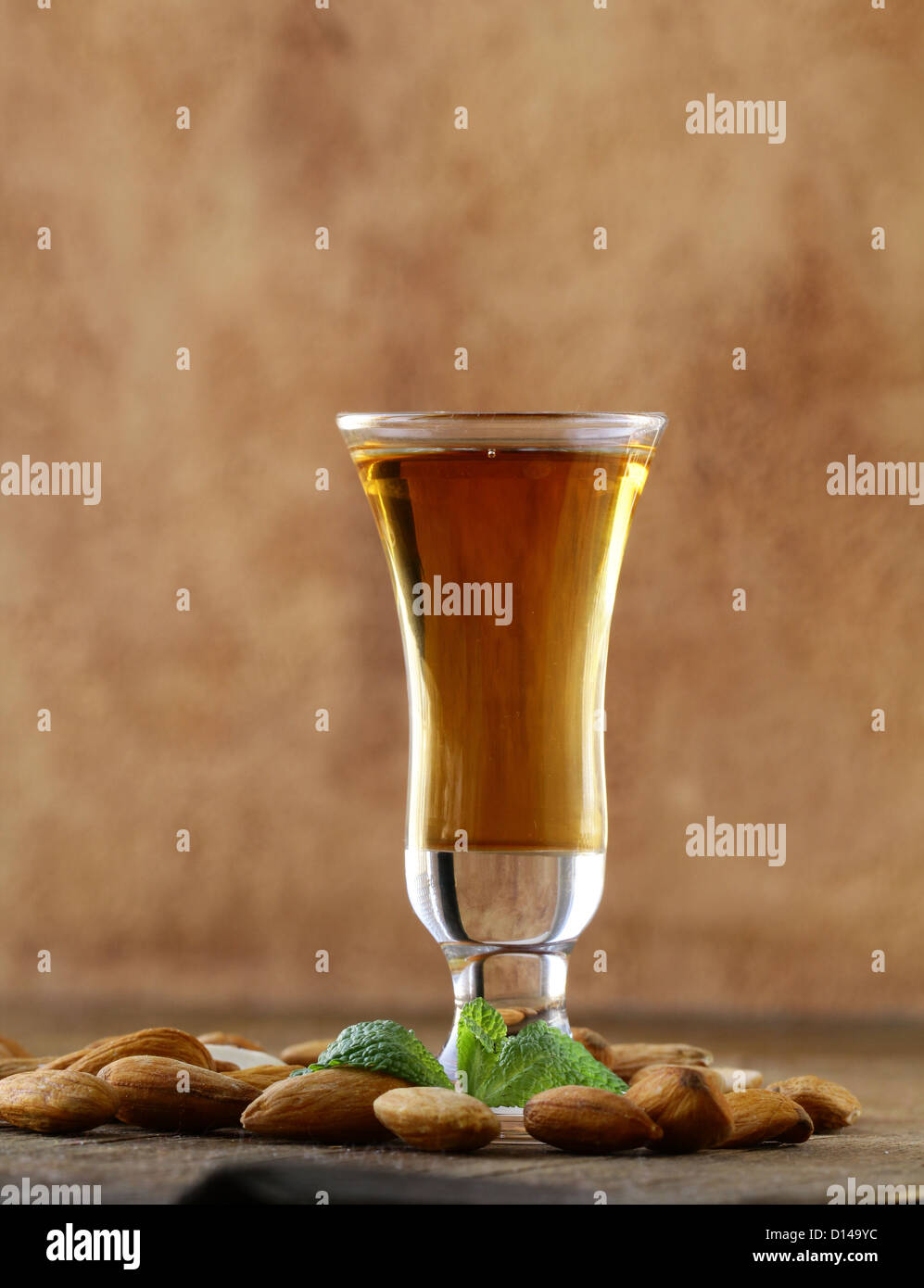 Almond liquor amaretto with whole nuts Stock Photo - Alamy