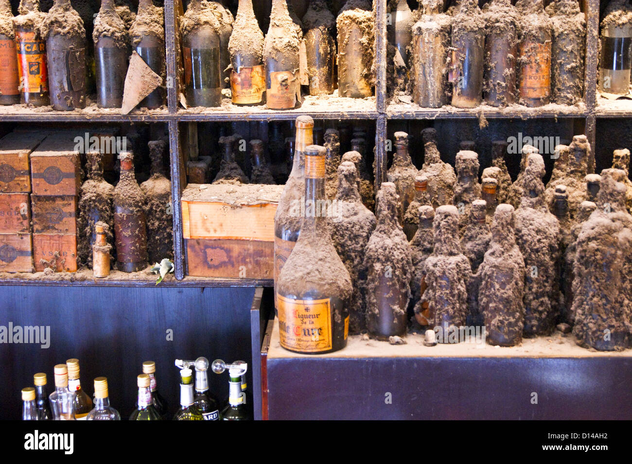 Dusty wine and liqueur bottles used as candlesticks in Brasserie Pere ...