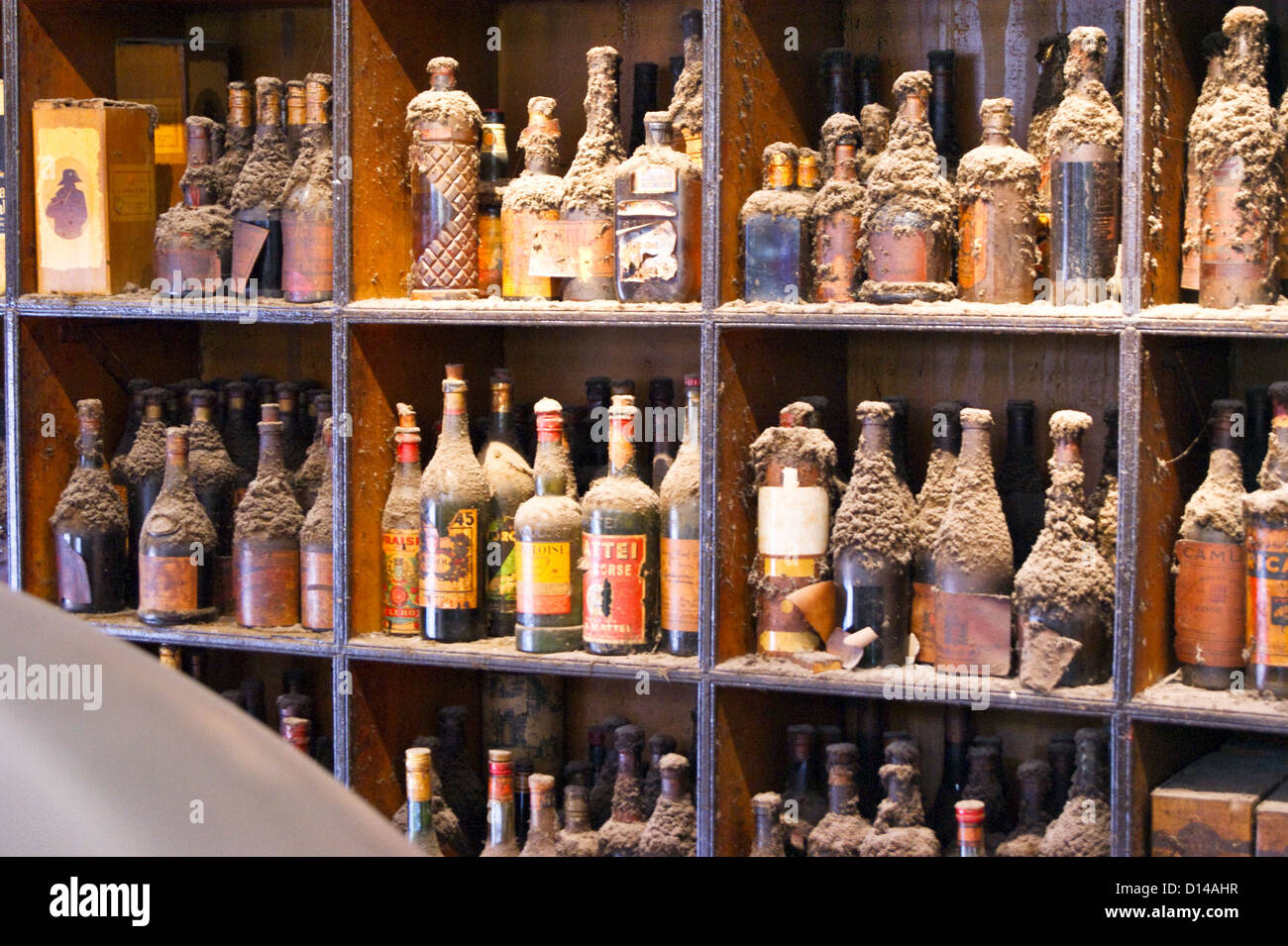 Dusty wine and liqueur bottles used as candlesticks in Brasserie Pere ...