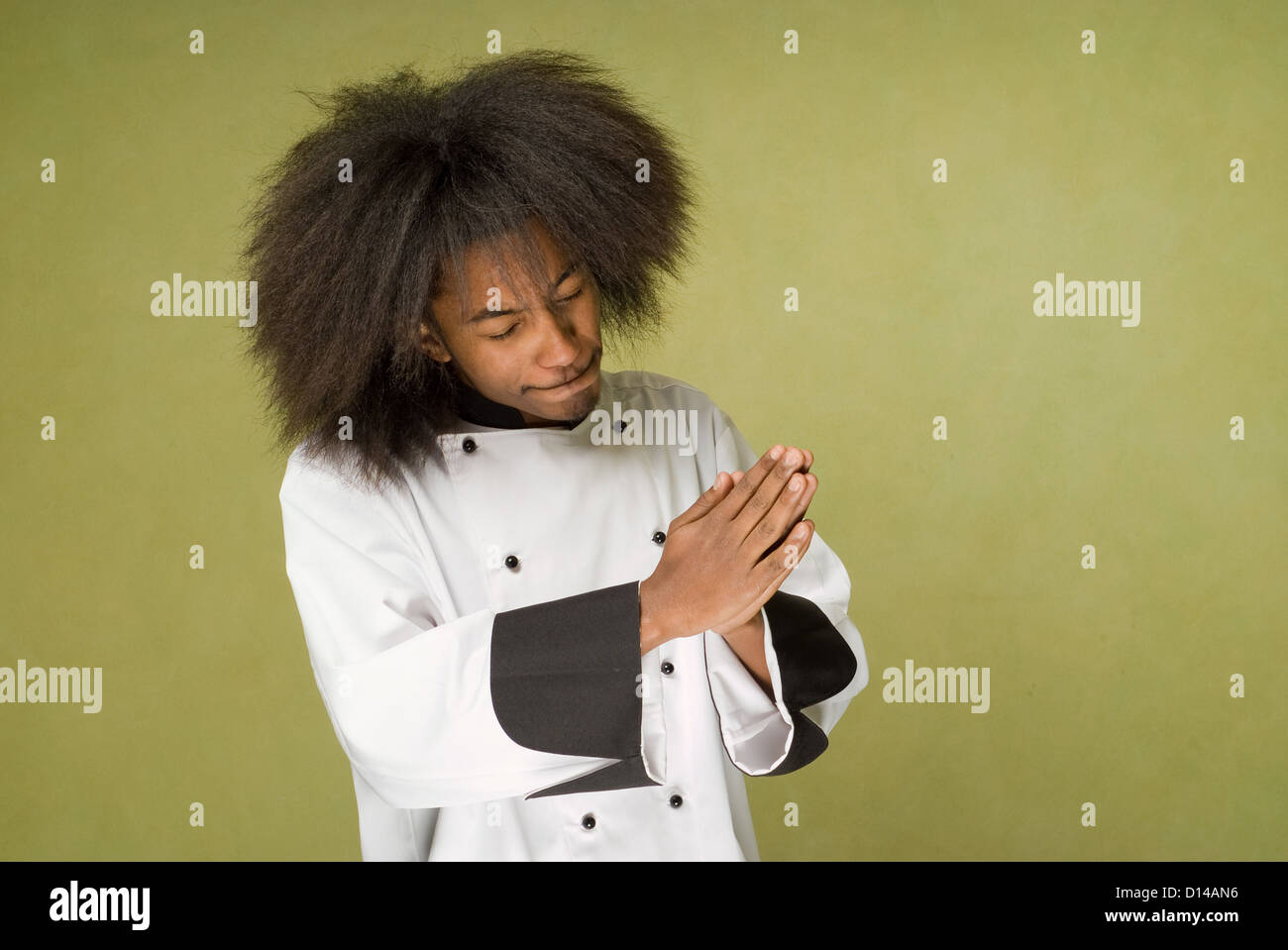 Young African American Chef Standing in Prayer Stock Photo - Alamy